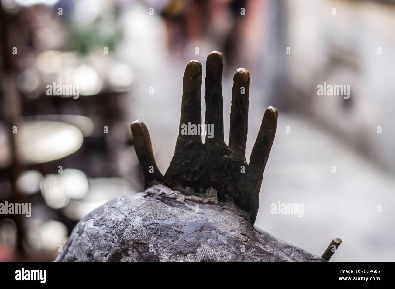 Hand behind fabric shadow silhouette. Conceptual art photo. Place for ...