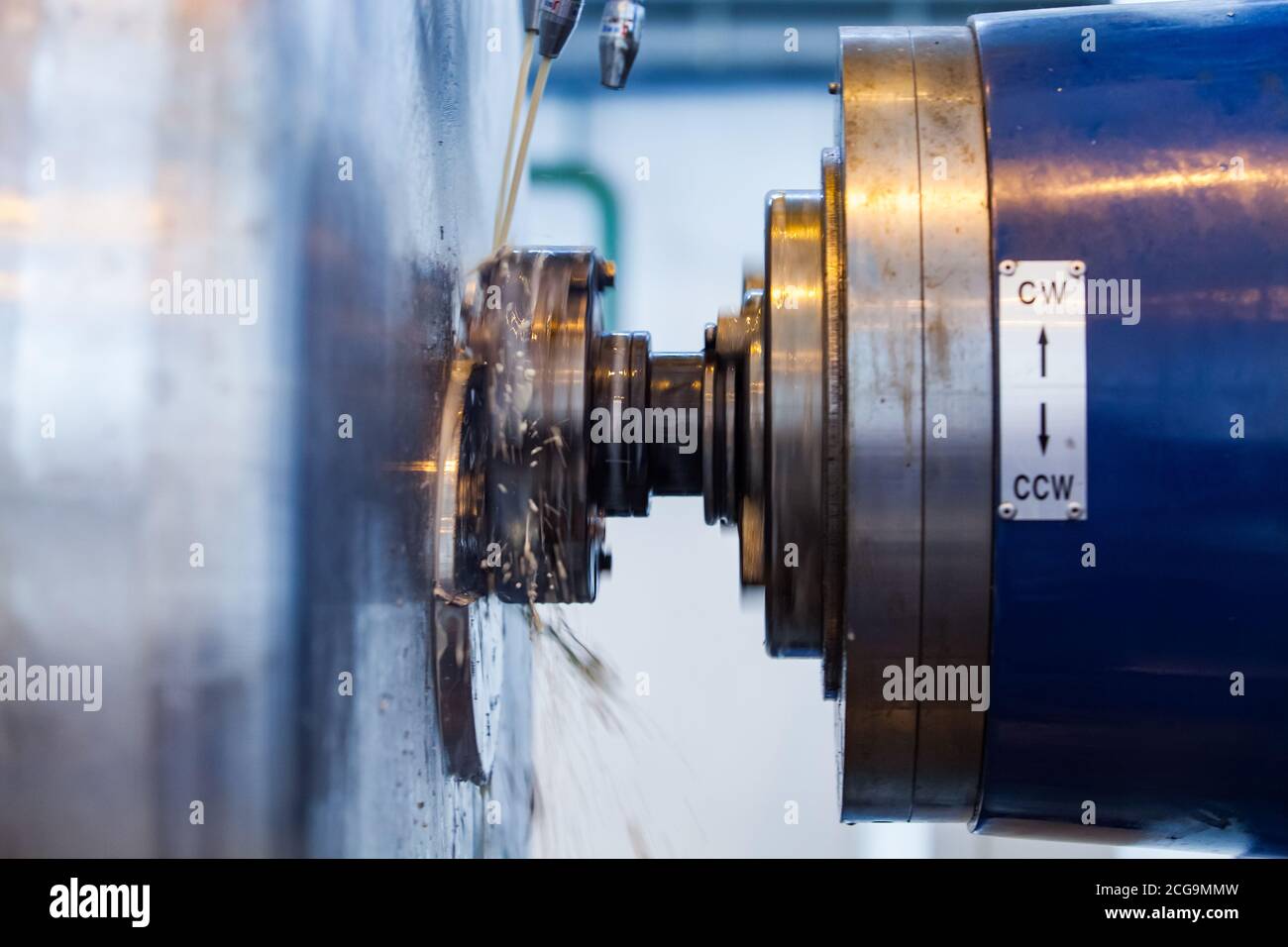 Cooling titanium rod with oil on metal turning lathe. Mechanical ...