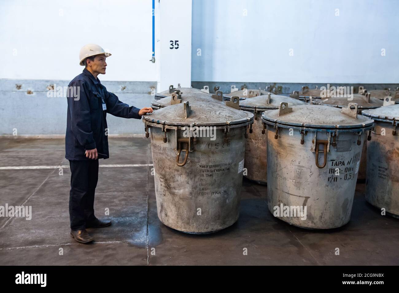 Titanium metallurgy plant. Engineer metallurgist on titanium warehouse ...