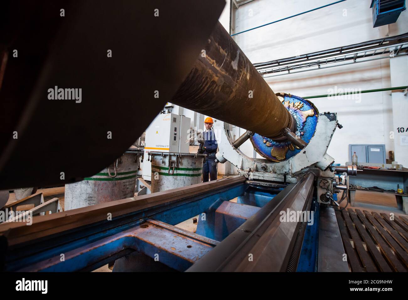 Metal titanium cylinder before mechanical works on turning lathe ...