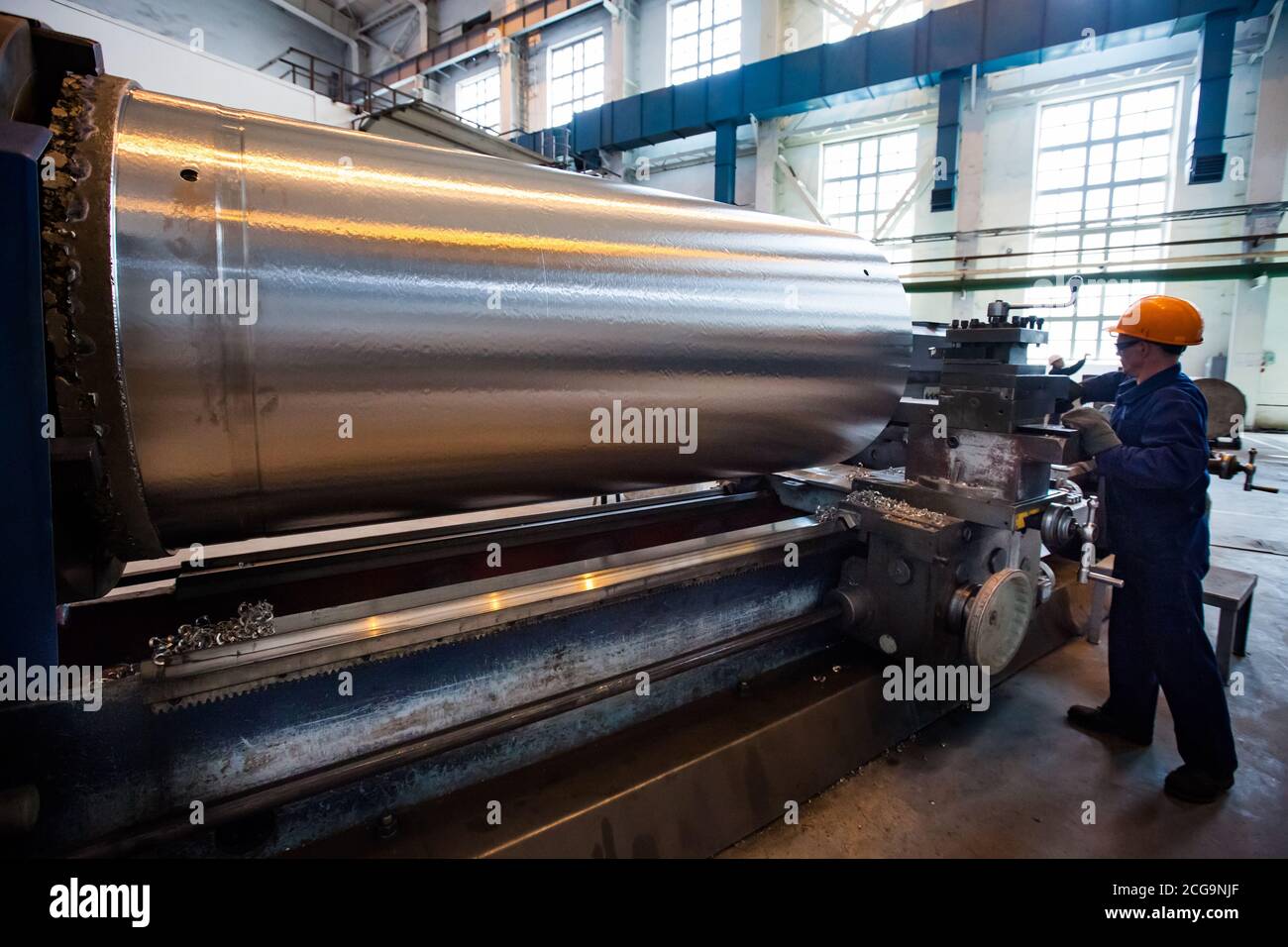 Metal titanium cylinder after mechanical works on turning lathe ...