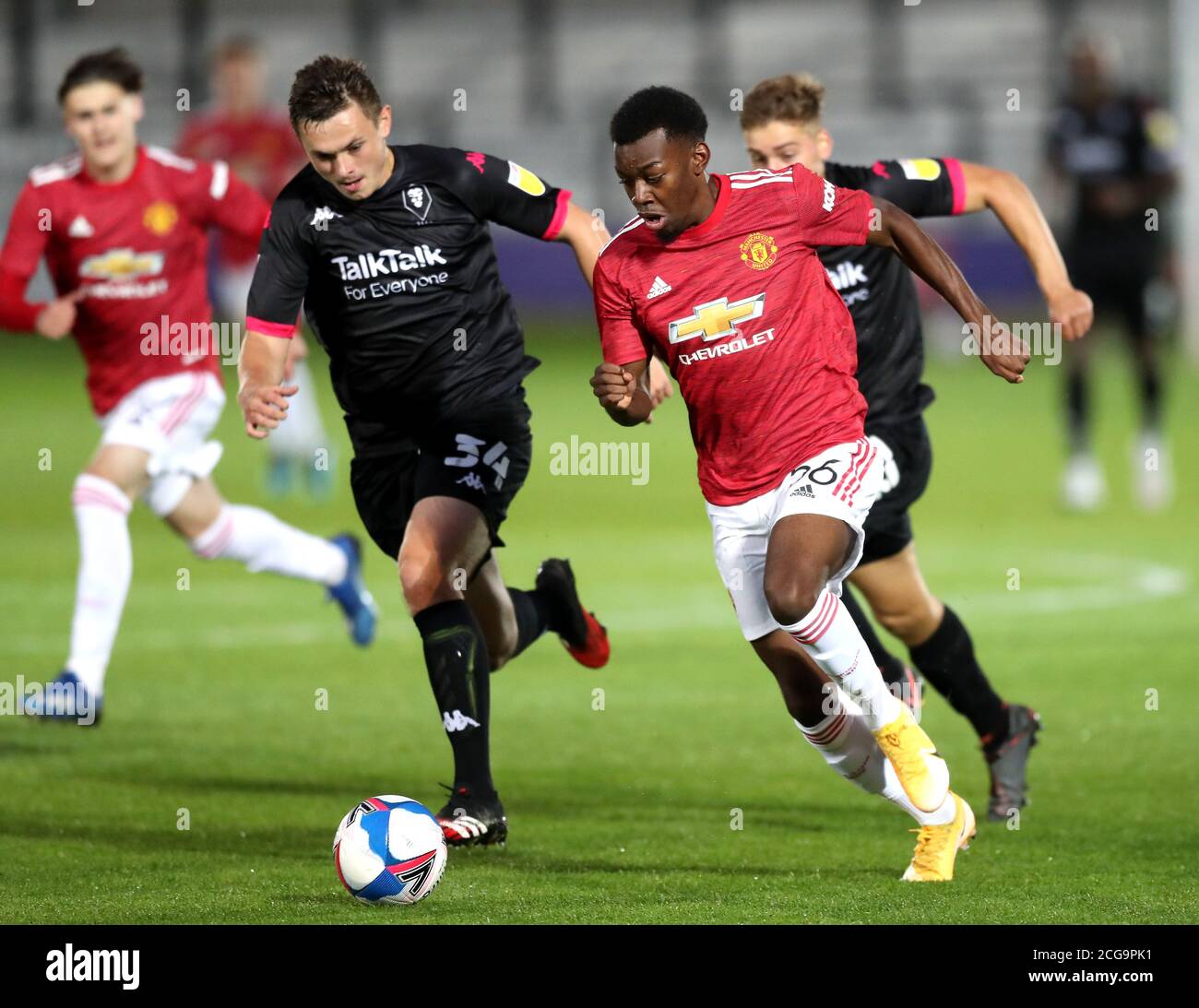 Manchester United's Anthony Elanga (right) and Salford City's Alex ...