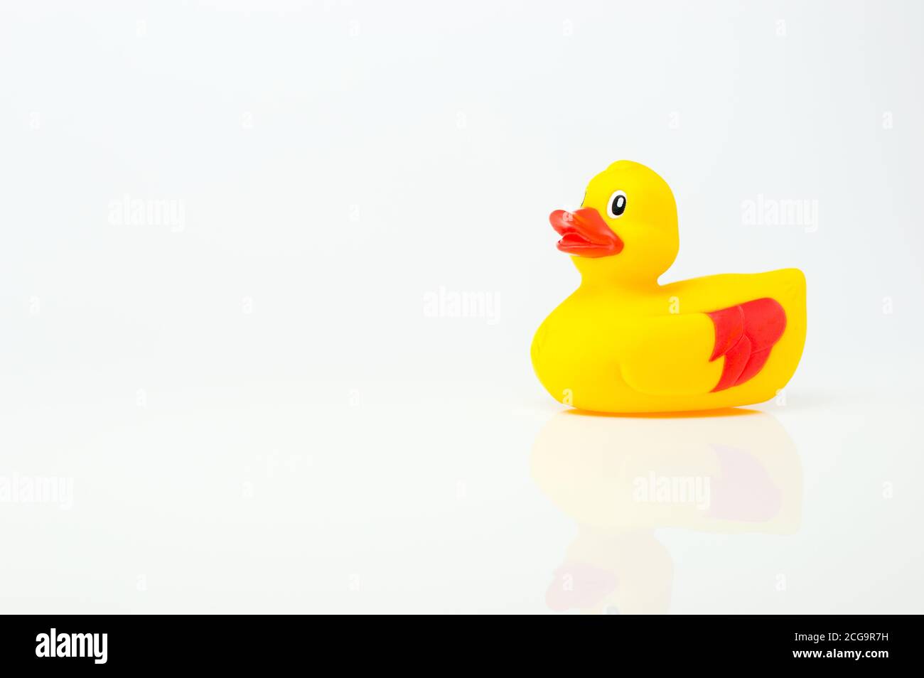 Yellow rubber duck with brown wings, showing a happy smile Stock Photo ...