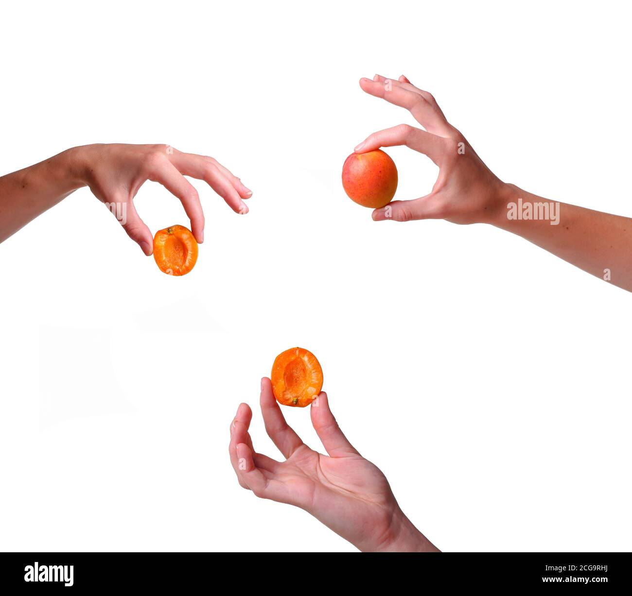 Female hand with tasty apricot on white background. Cream for hands and ...