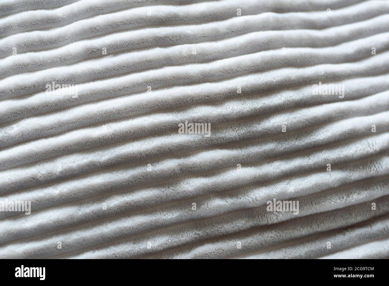 Wavy background of gray color from plush (fur) material, fabric ...