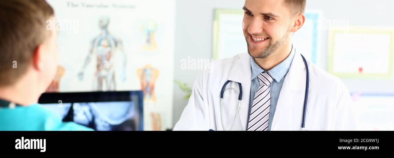 Smart doctor smiling Stock Photo - Alamy
