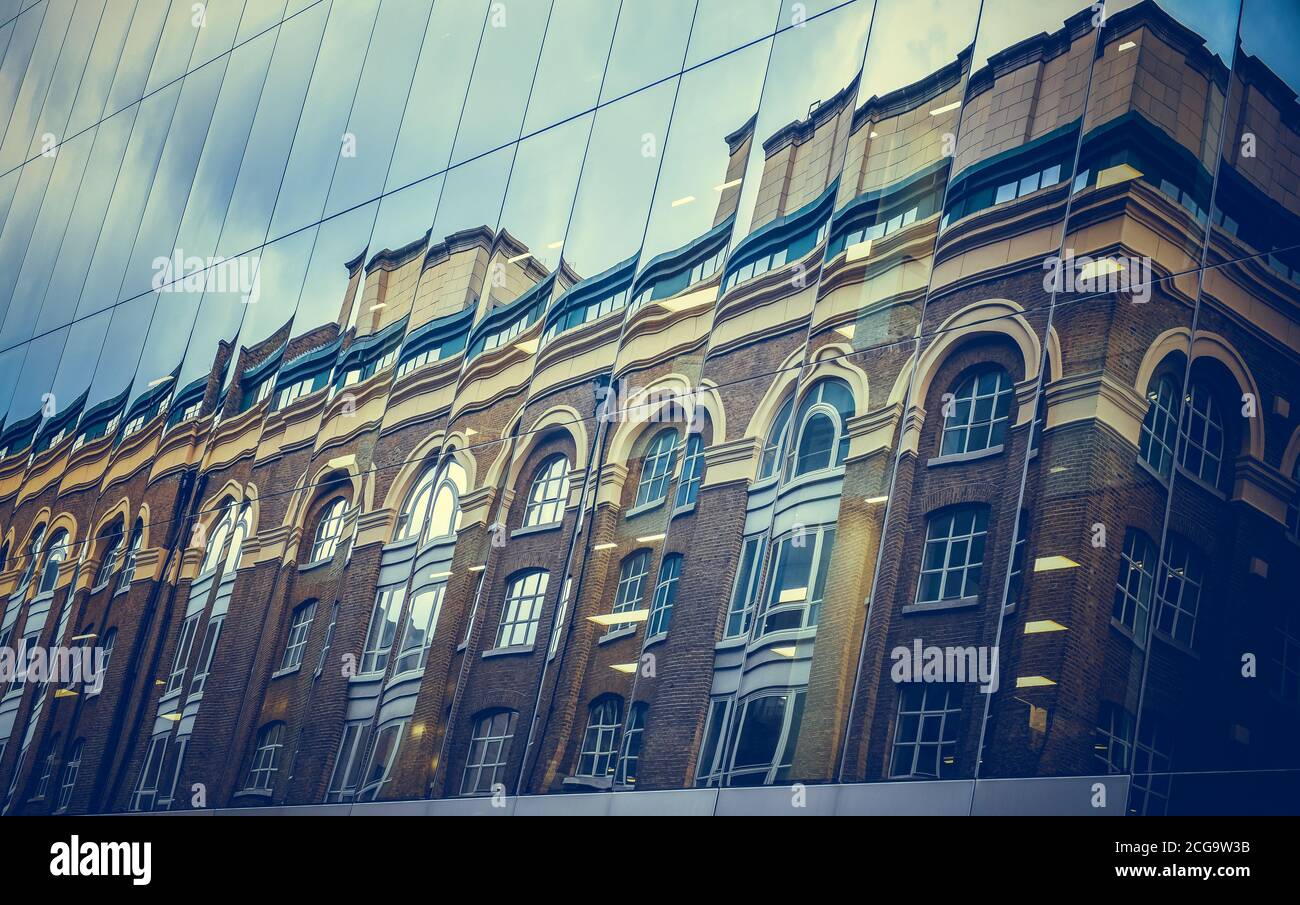Office building windows background. Buildings reflected in windows of ...