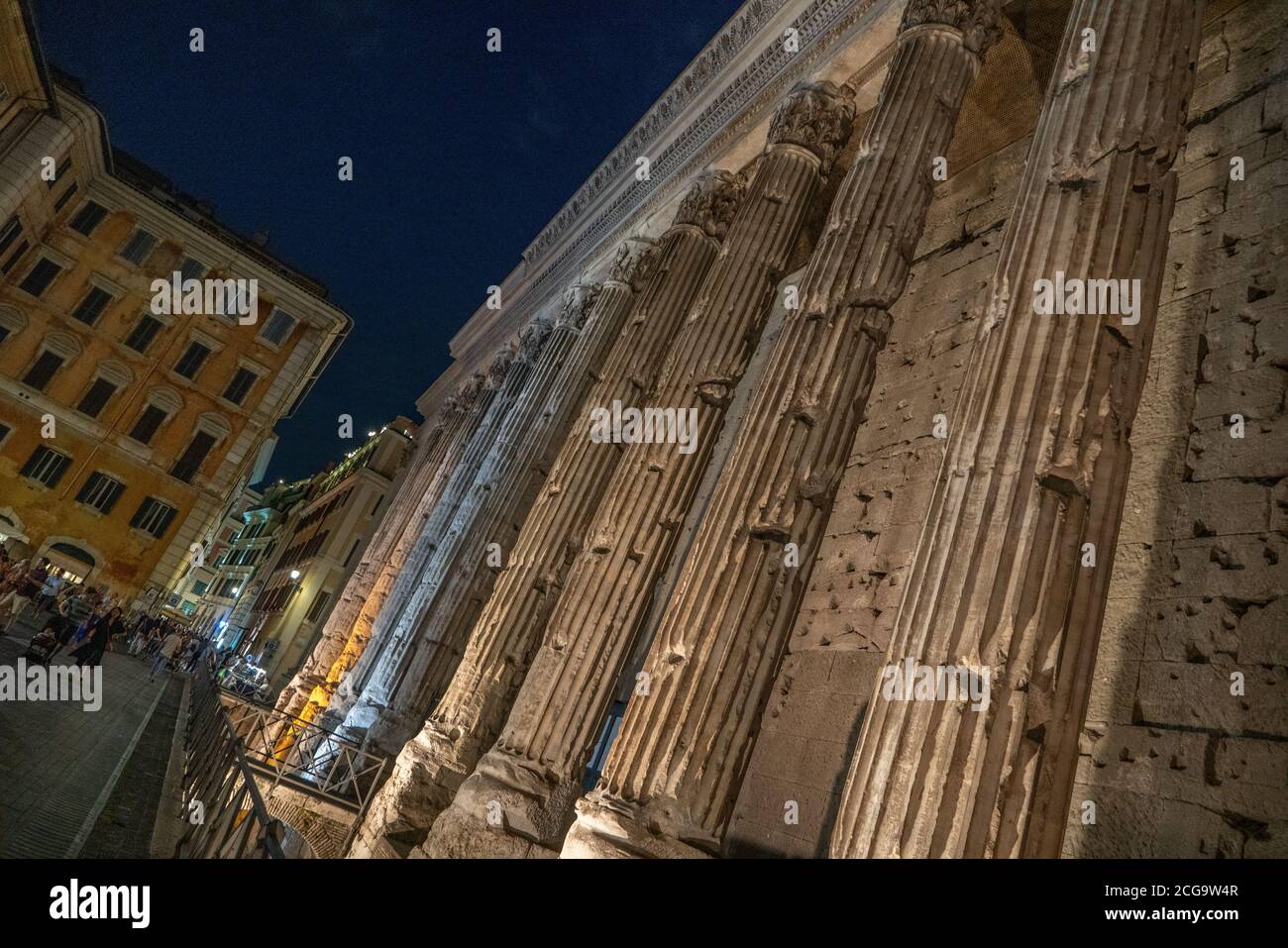The Temple of the Divine Adrian at night in Rome, Italy Stock Photo - Alamy
