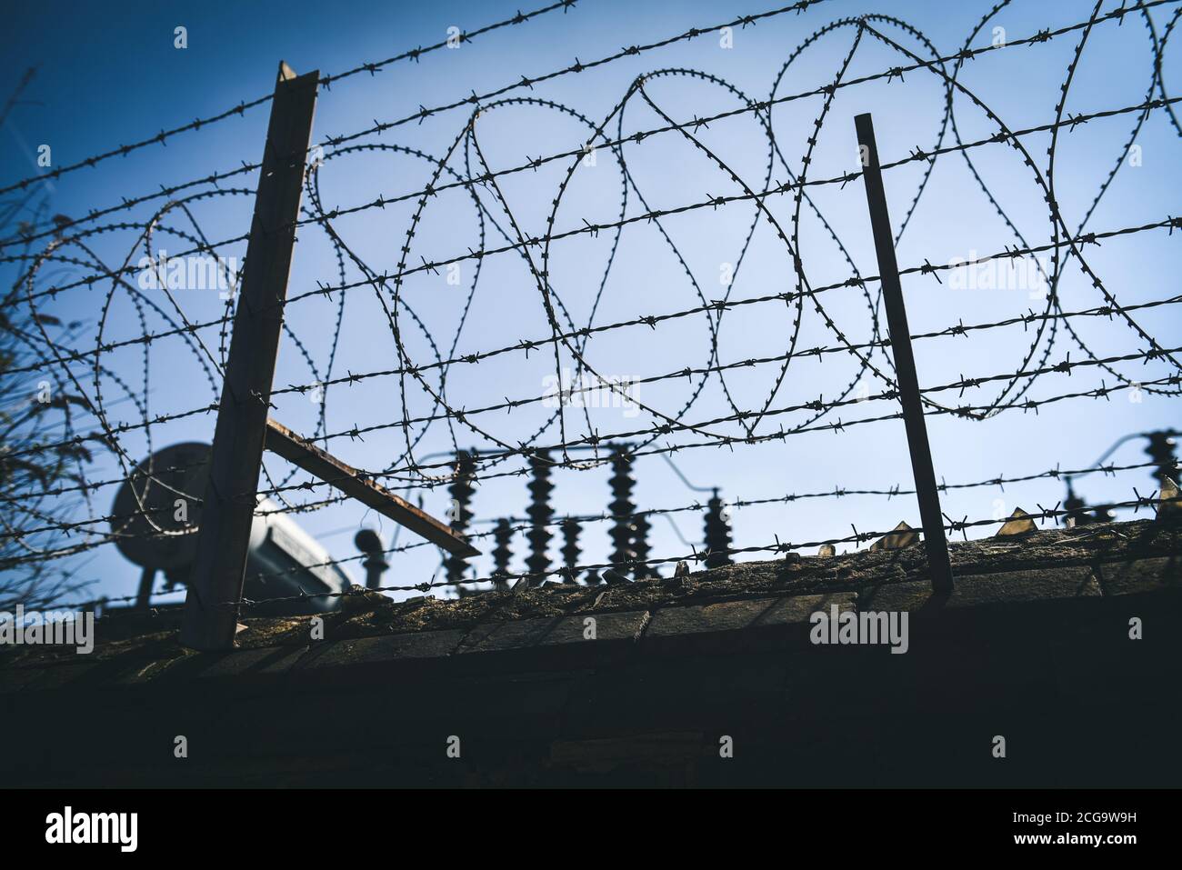 a dangerous fence of barbed wire Stock Photo - Alamy