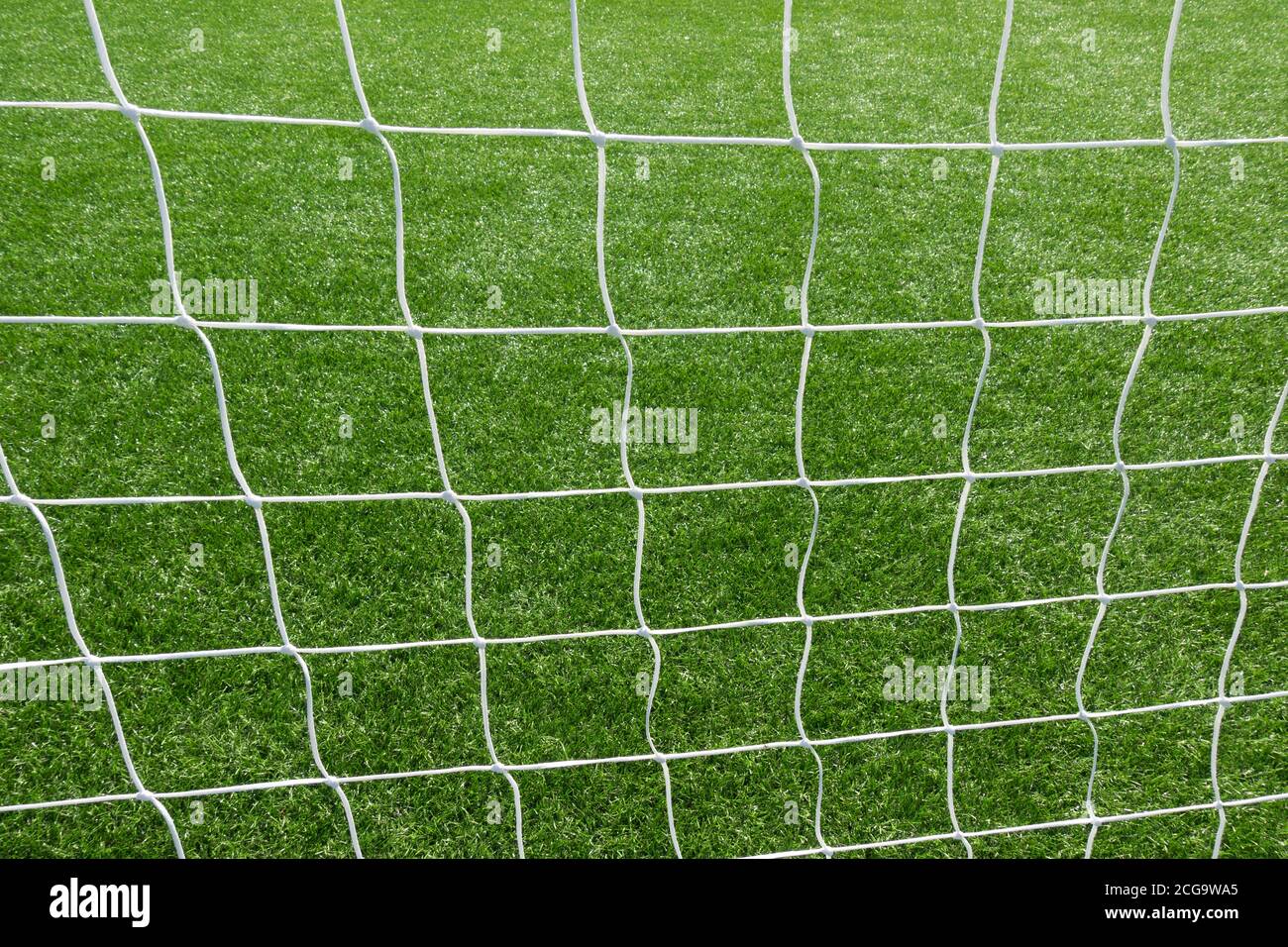 Close up of football soccer goal net with green grass background Stock ...