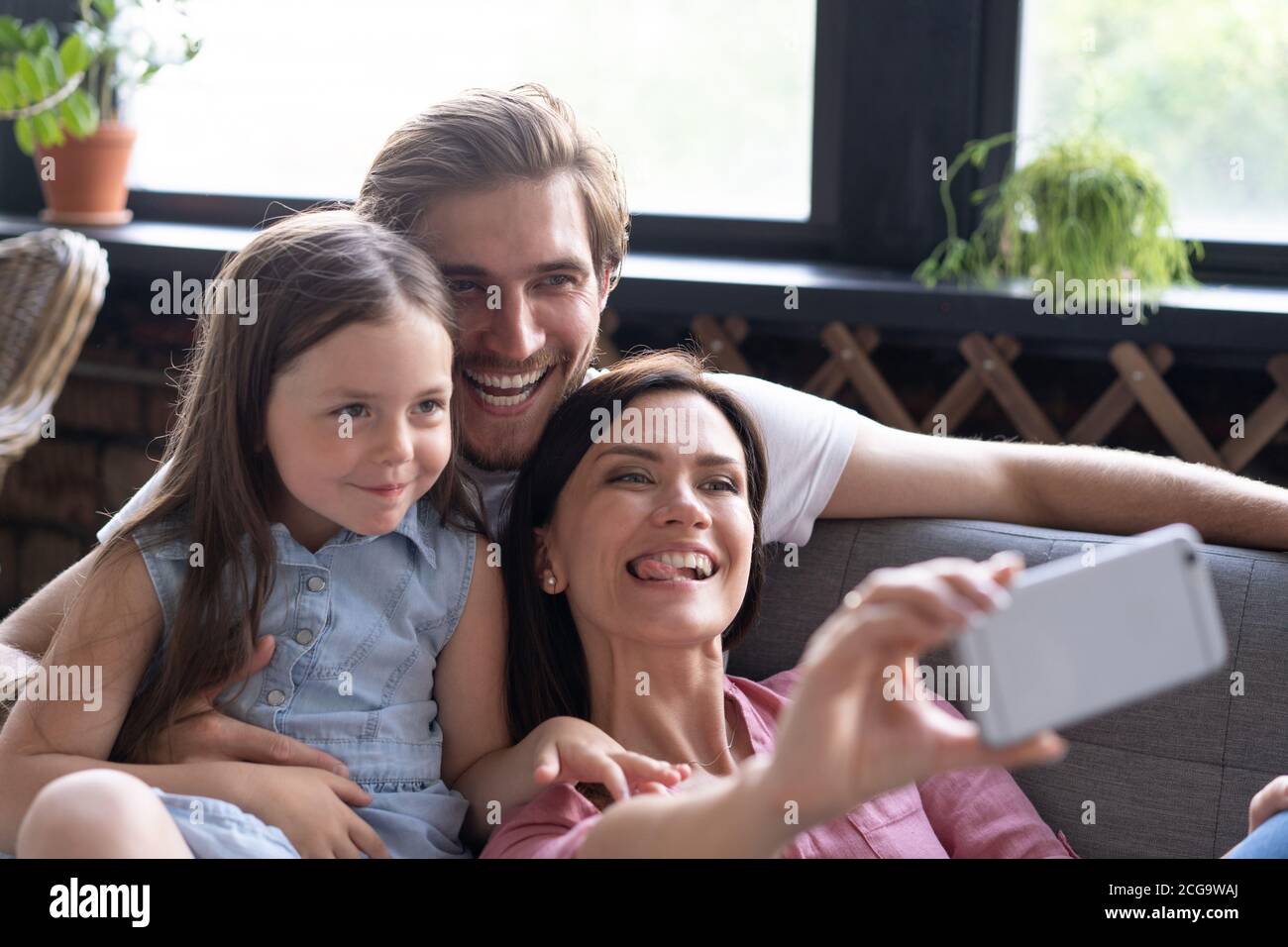 Playful family taking selfie camera phone hi-res stock photography and ...
