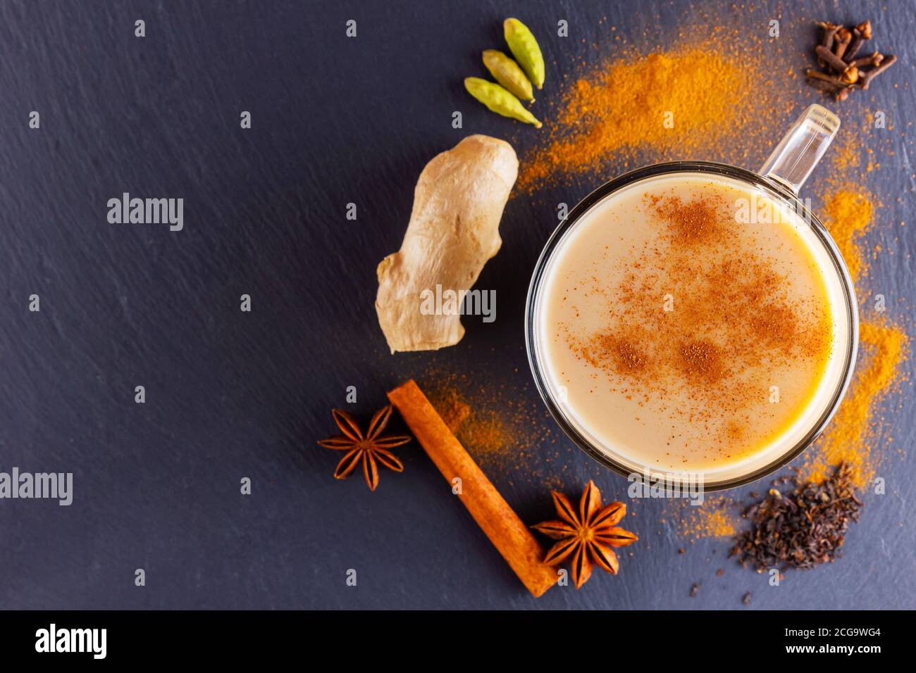 Masala chai tea on a black background. Traditional indian drink ...