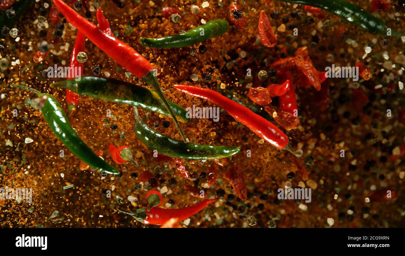 Mix of various kind of spices flying in the air. Zero gravity concept ...