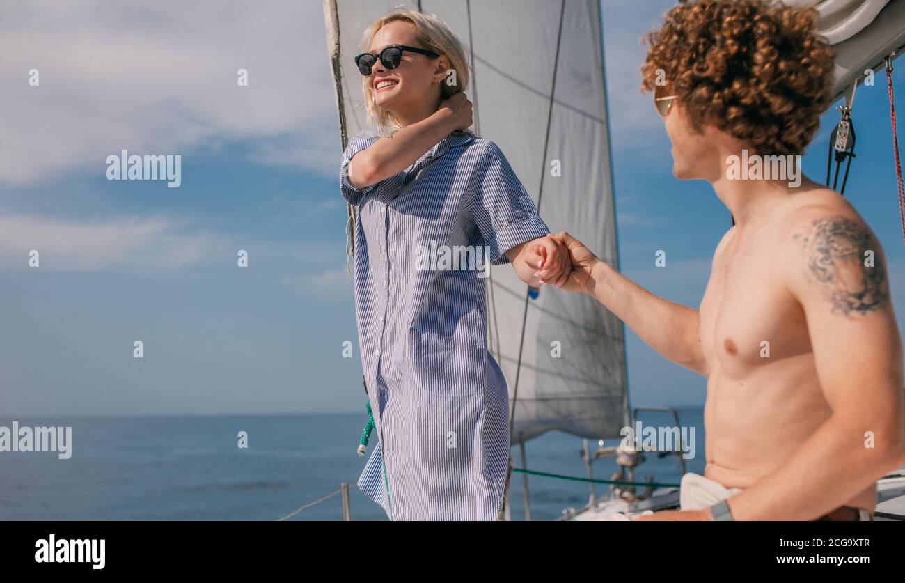 Marine holiday on sailing yacht. Joyful caucasian couple on pleasure ...