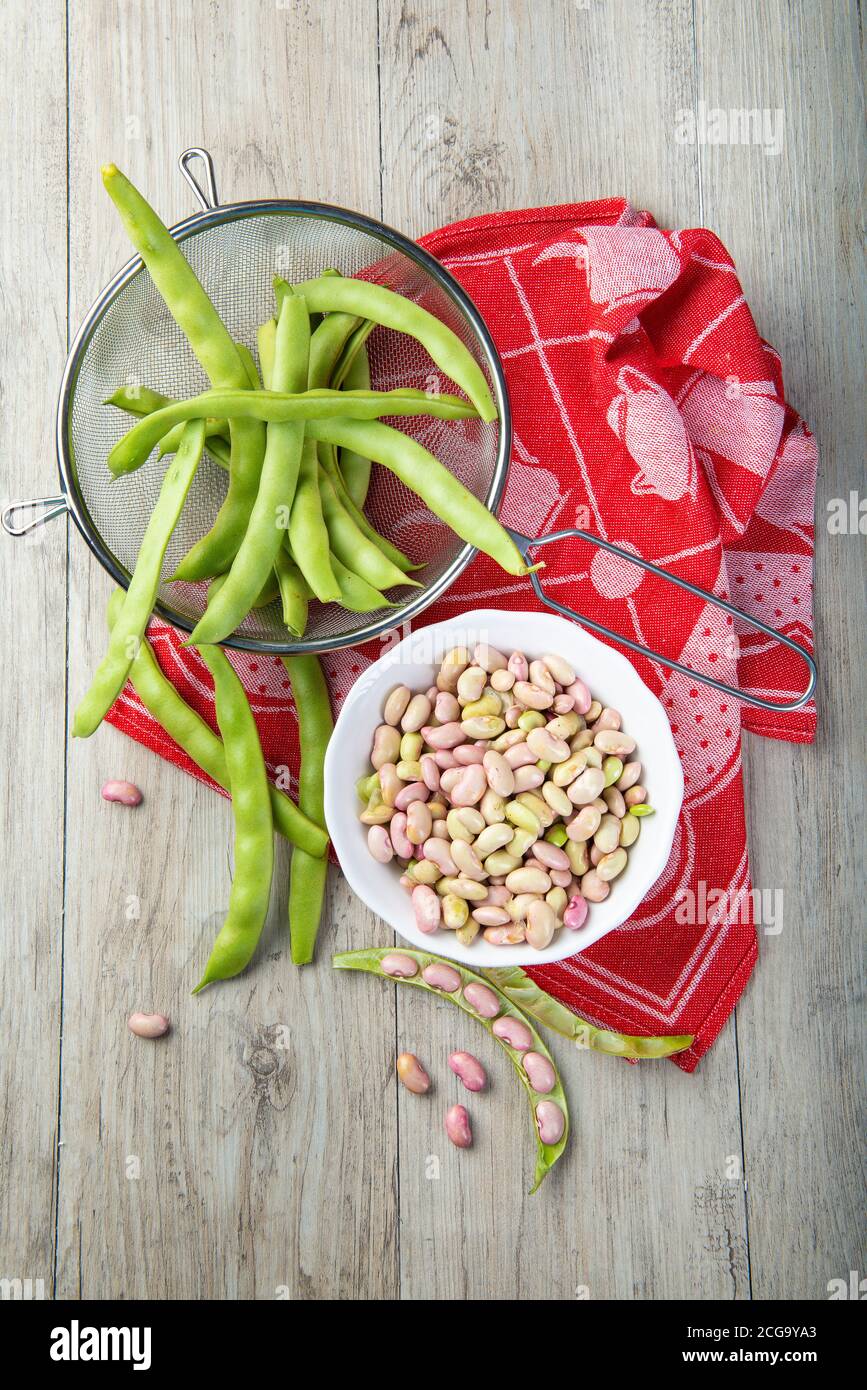 Getting beans from their pods and preparing them for cooking in the ...