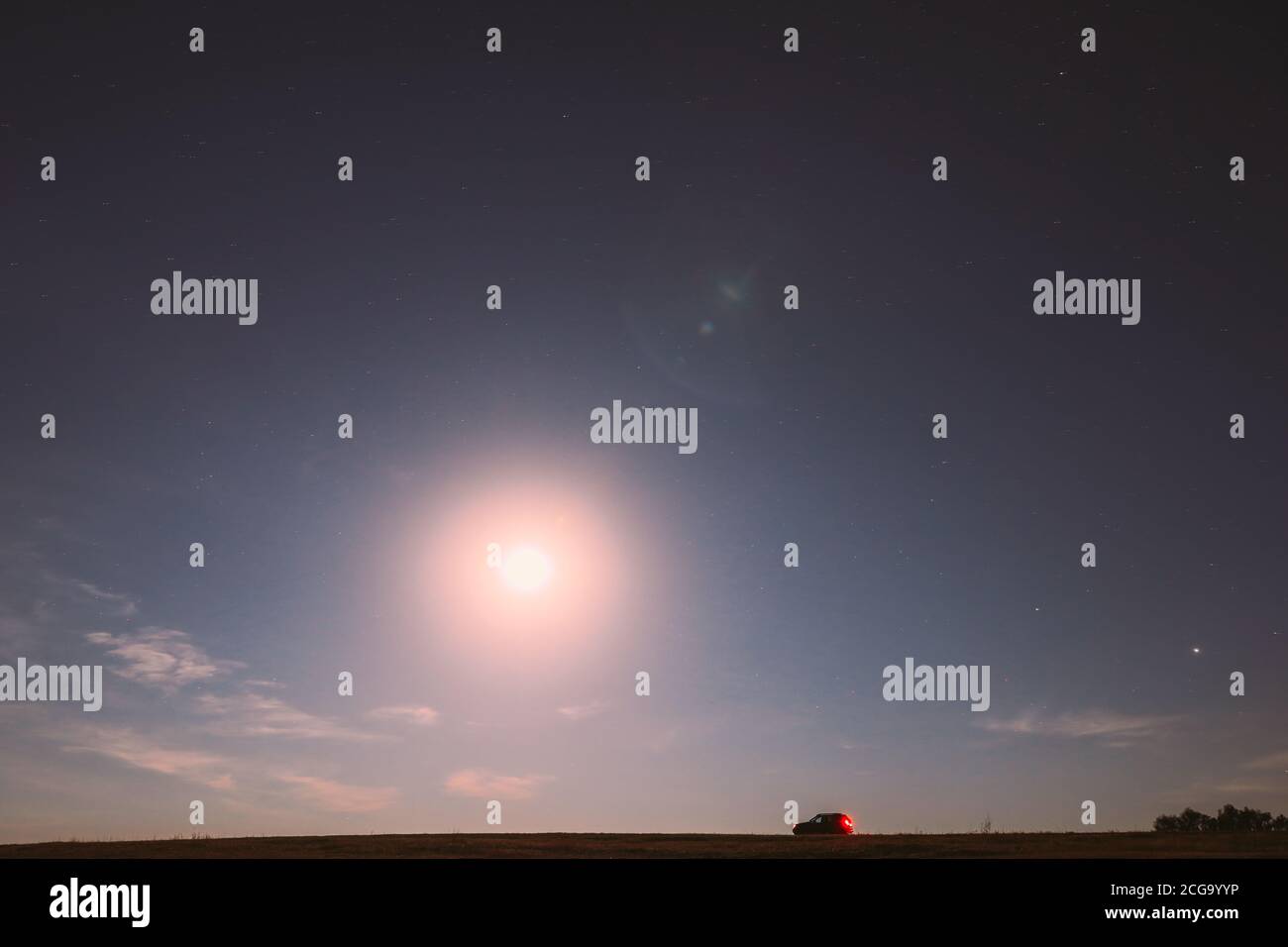 Full Moon Rising Above Field In Countryside. Night View Of Natural ...