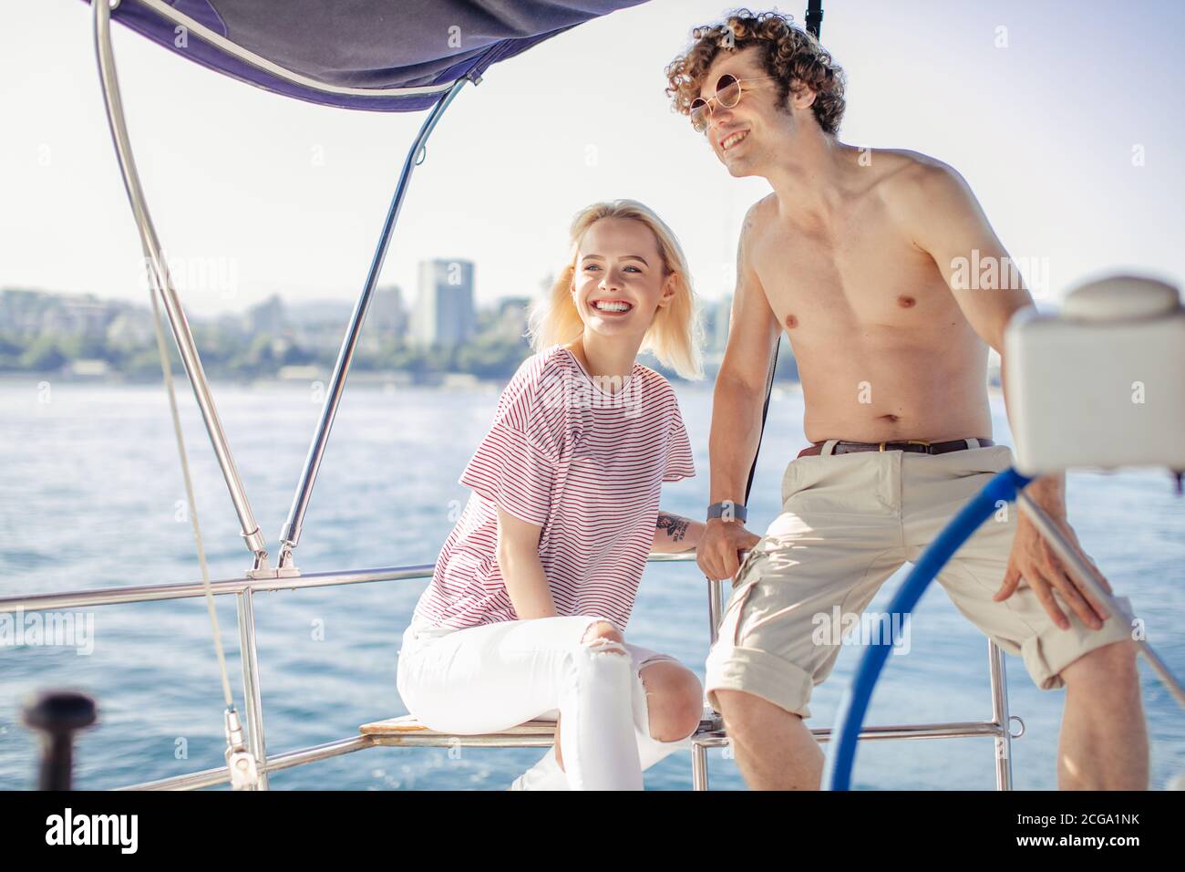 Marine holiday on sailing yacht. Joyful caucasian couple on pleasure ...