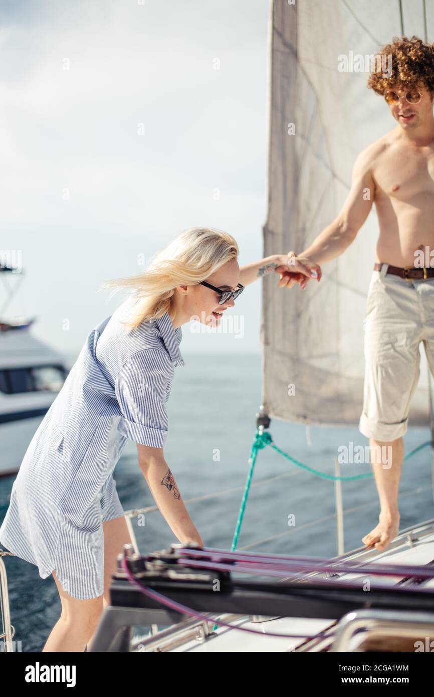 Marine holiday on sailing yacht. Joyful caucasian couple on pleasure ...