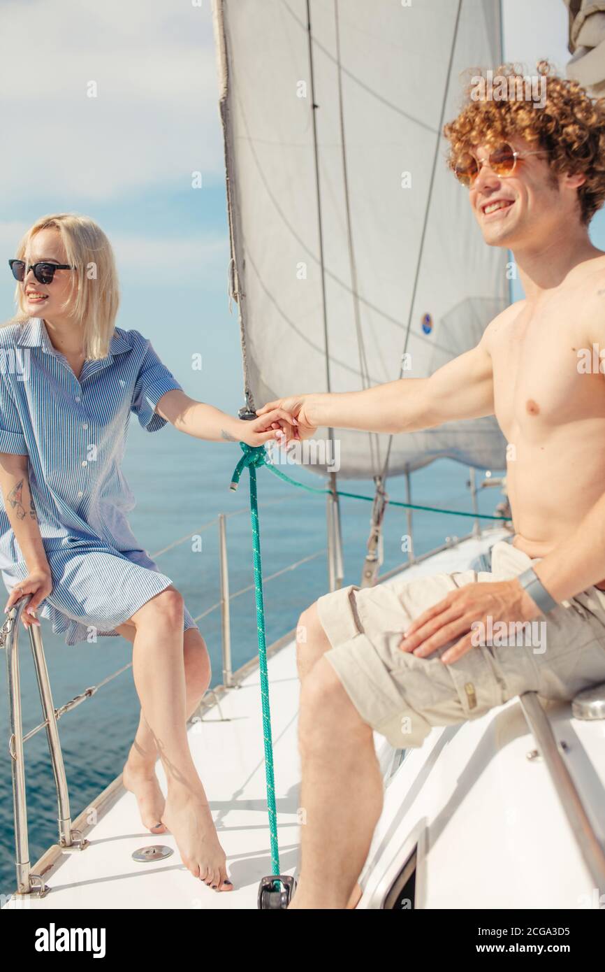Marine holiday on sailing yacht. Joyful caucasian couple on pleasure ...