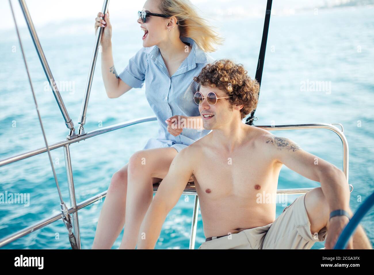 Young beautiful rich married couple og caucasian people relaxing ...