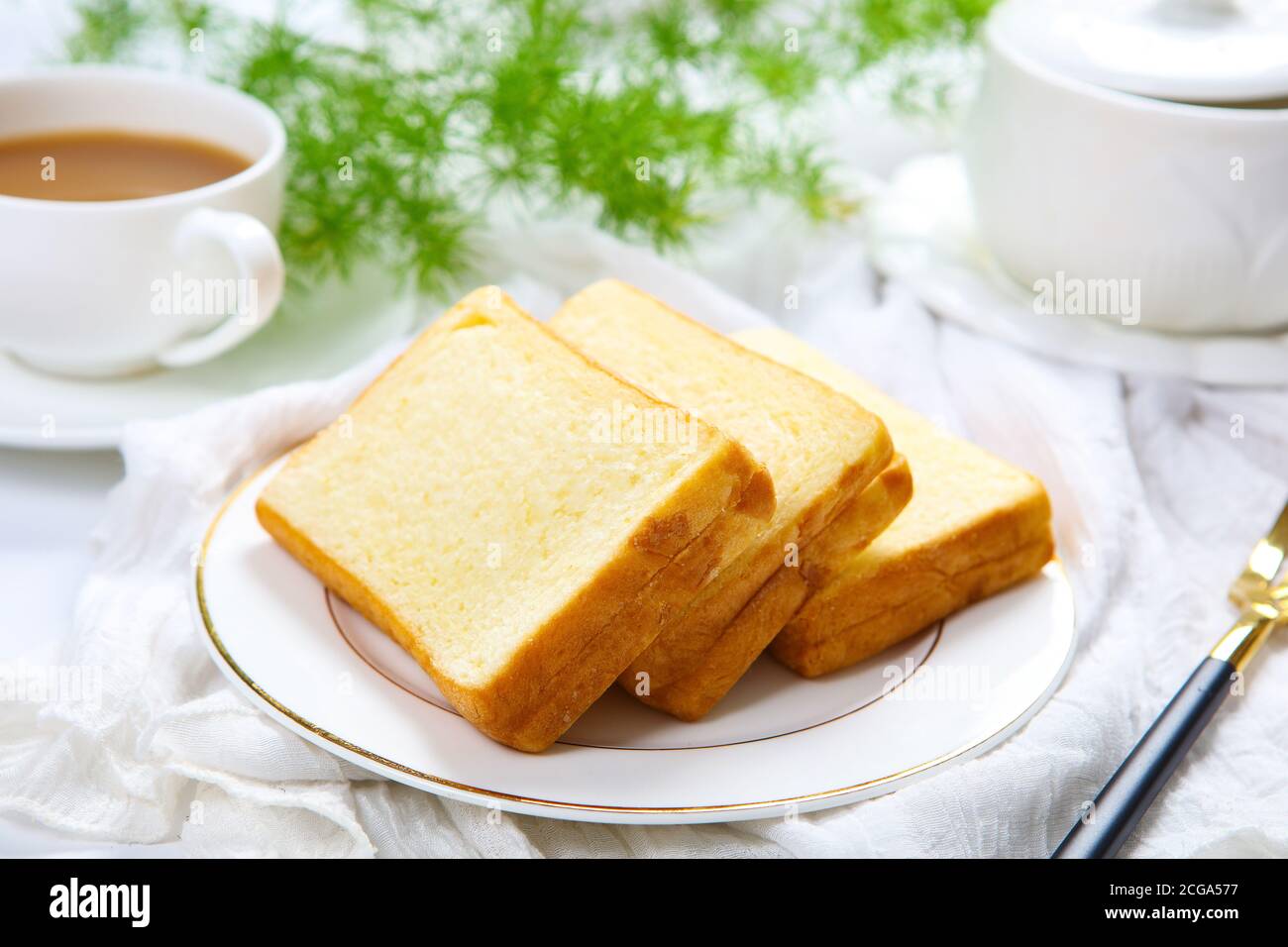 Hand bread delicious afternoon tea Stock Photo - Alamy