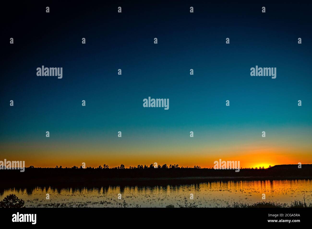 The sun sets over Upper Lake Mary in the Cocnino National Forest near ...