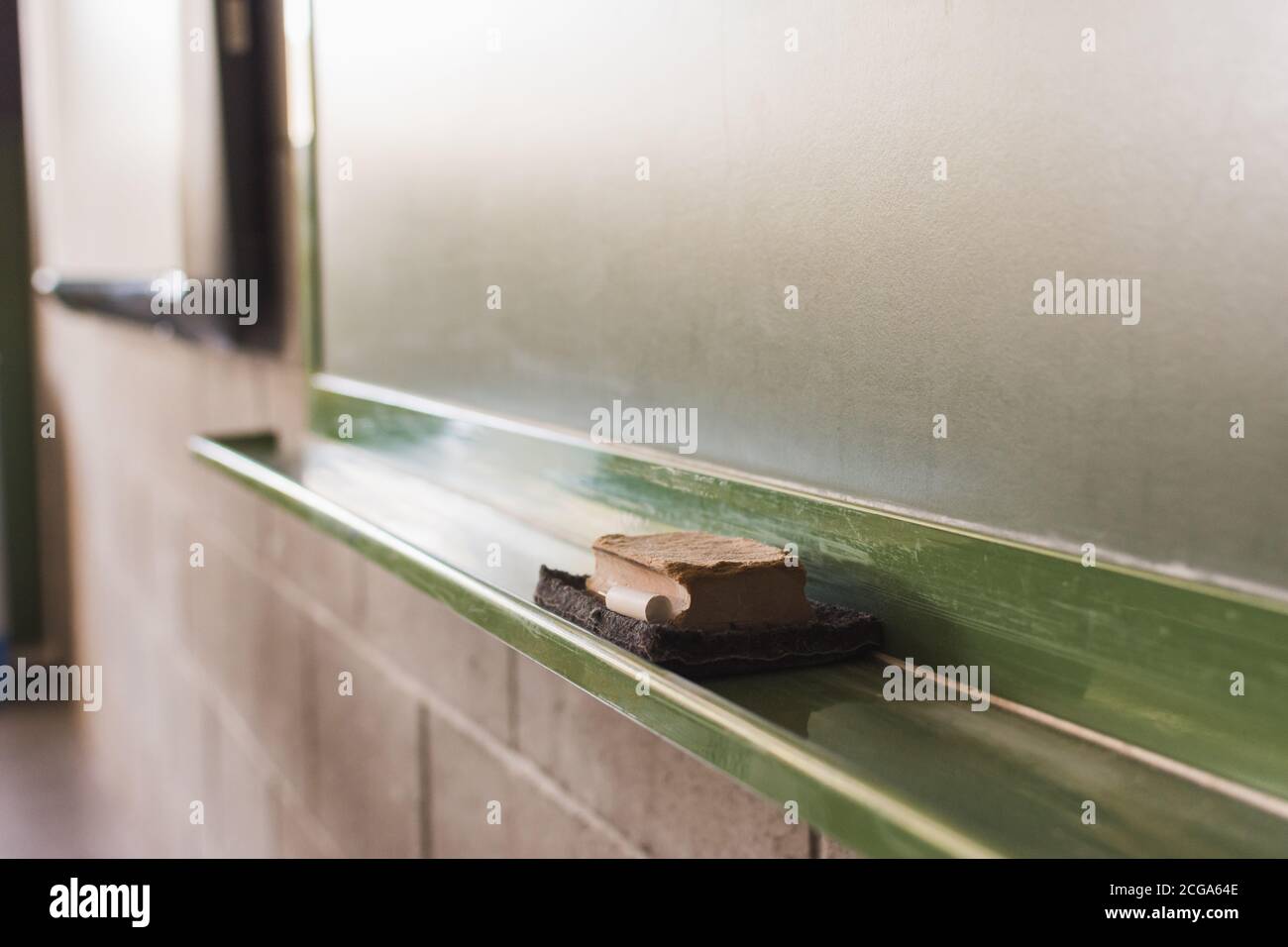 Eraser and chalk on the blackboard Stock Photo - Alamy