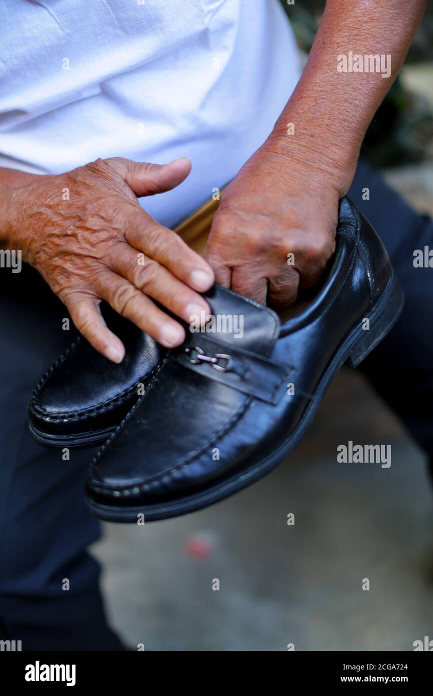 Man dressing shoes hi-res stock photography and images - Alamy