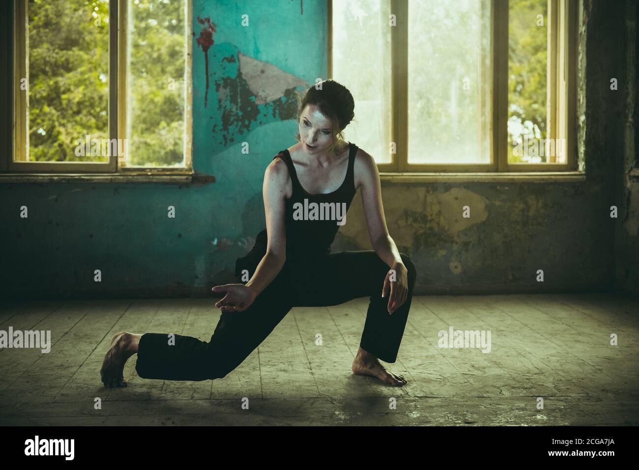 Girl choreographer dances in an old abandoned castle Stock Photo - Alamy