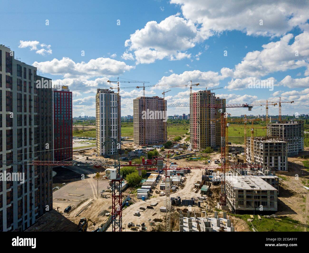 Construction site with multi-storey buildings, tower cranes and ...