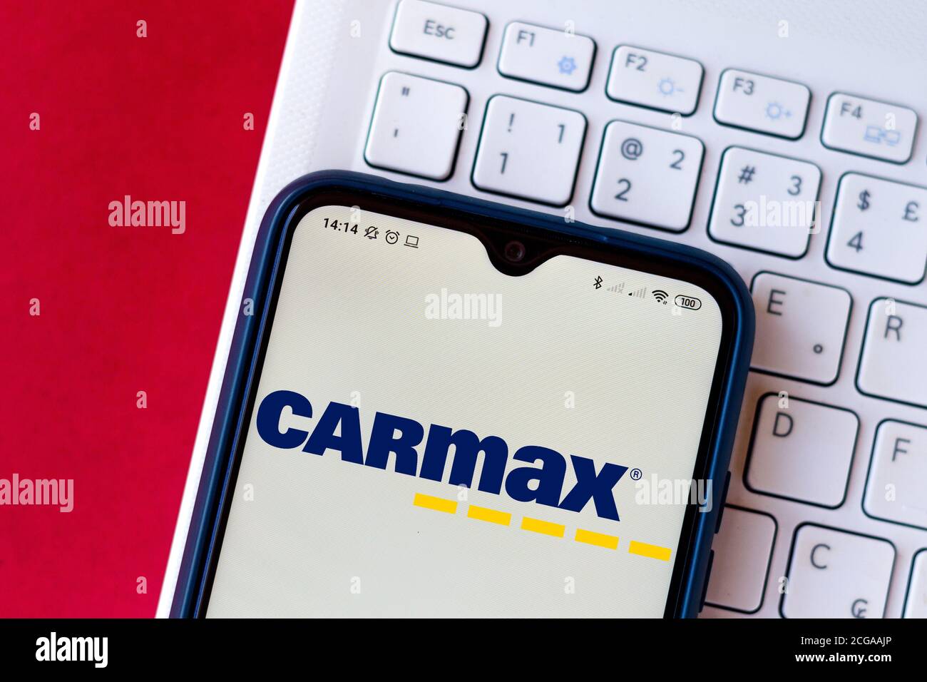 In this photo illustration the CarMax logo displayed on a smartphone ...