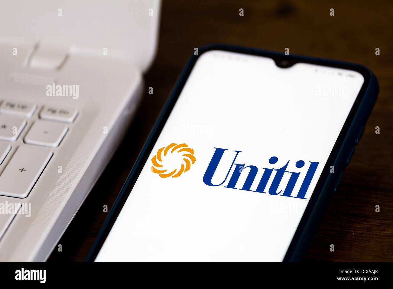 In this photo illustration the Unitil Corporation logo displayed on a ...