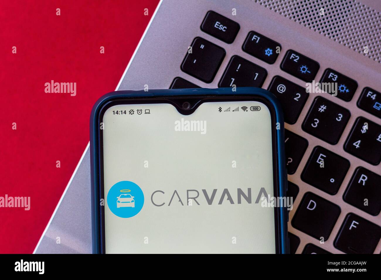 In this photo illustration the Carvana logo displayed on a smartphone ...