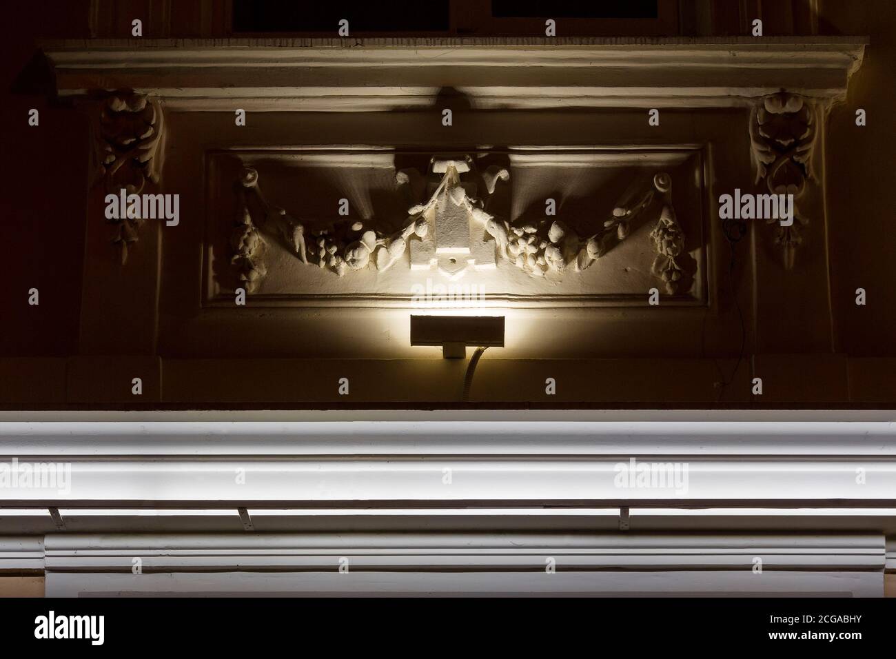 lantern illuminates the details of the architectural elements of ...