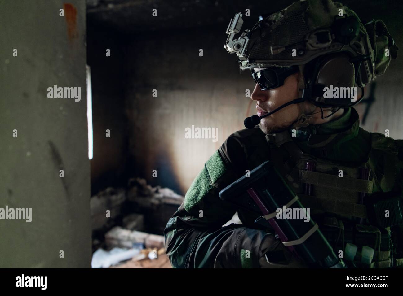 Soldier in combat. Urban combat training, soldier entering abandoned ...