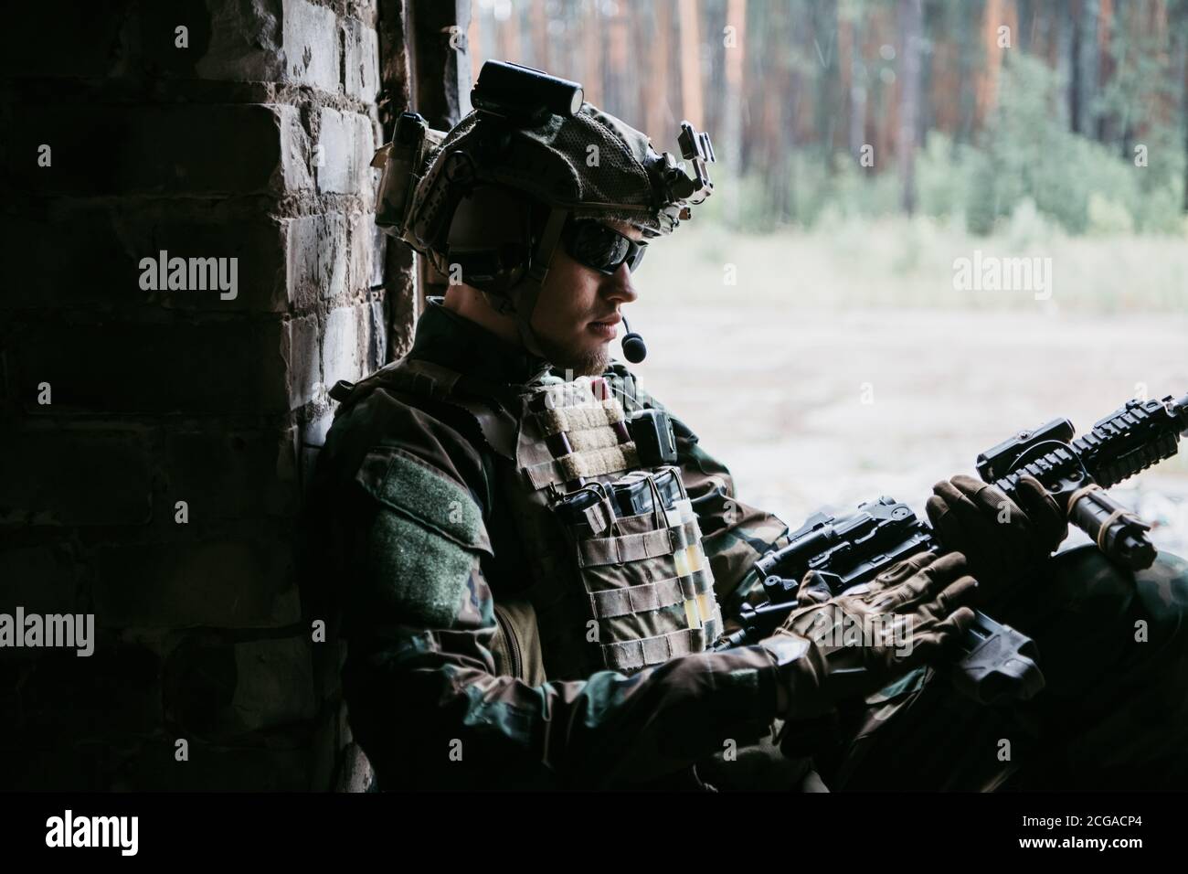 Weapon inspection while waiting on a spot. Military man checks his ...