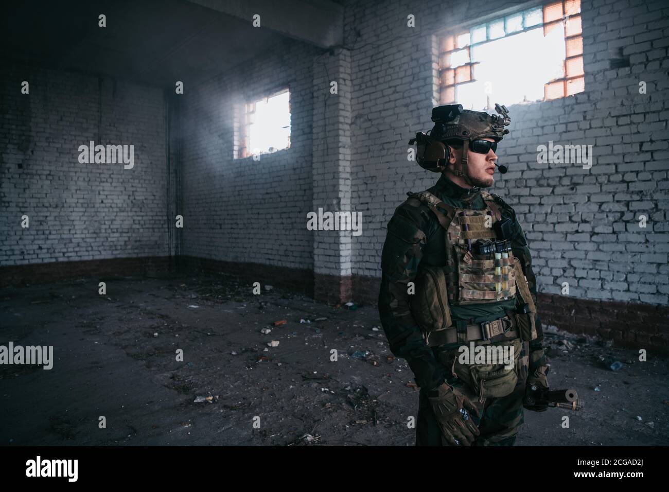 Front view close up of caucasian soldier with a rifle stand guard ...