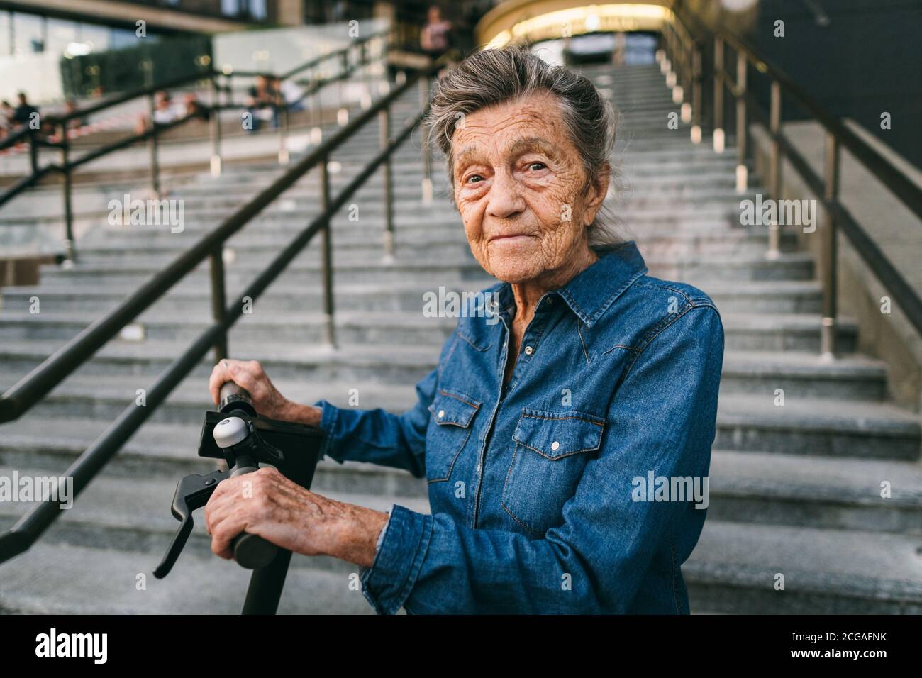 90 year old woman with gray hair, wrinkles, progressive and active uses ...