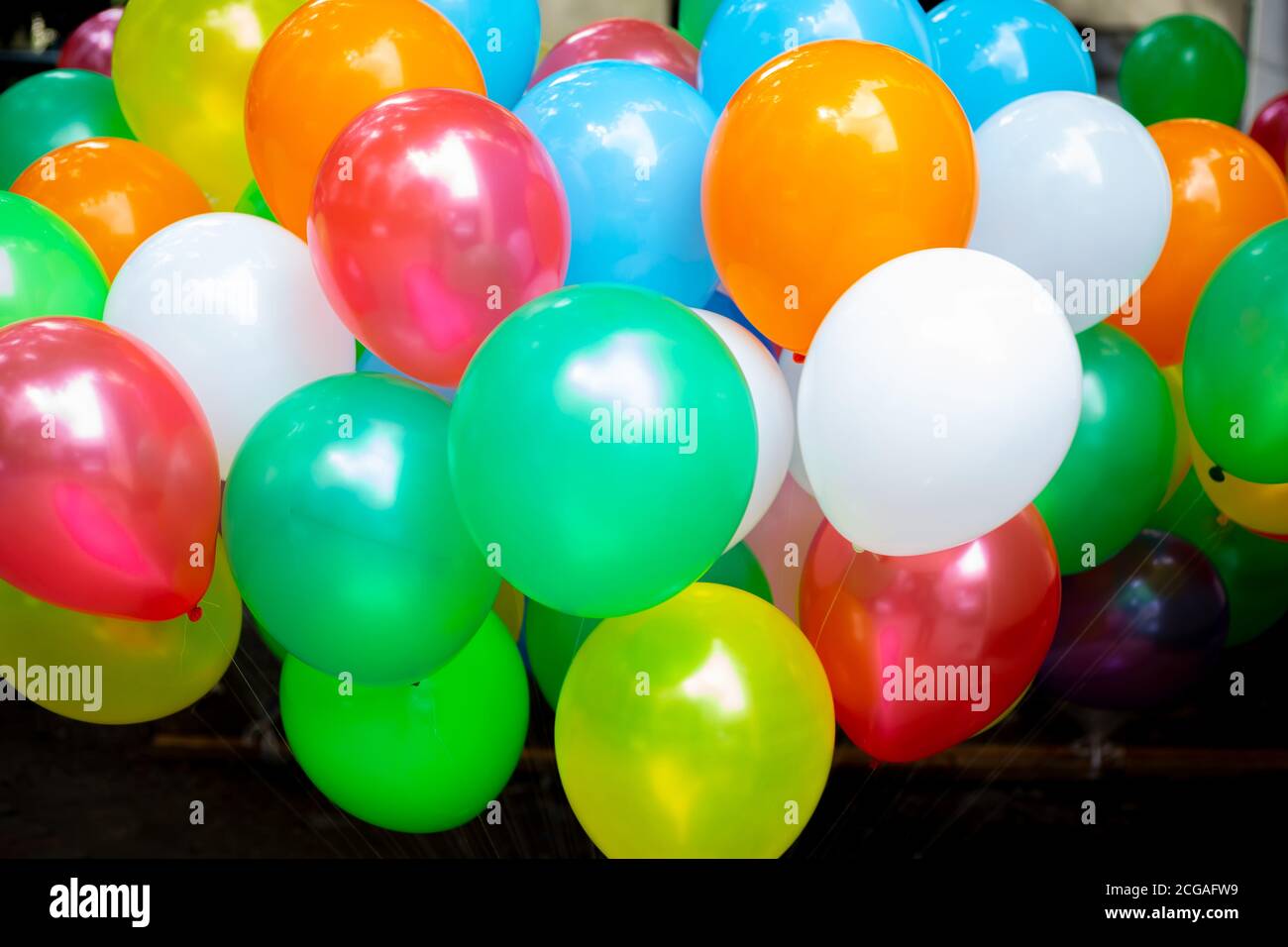 A lot of colorful balloons close-up views. Balloons of many colours ...