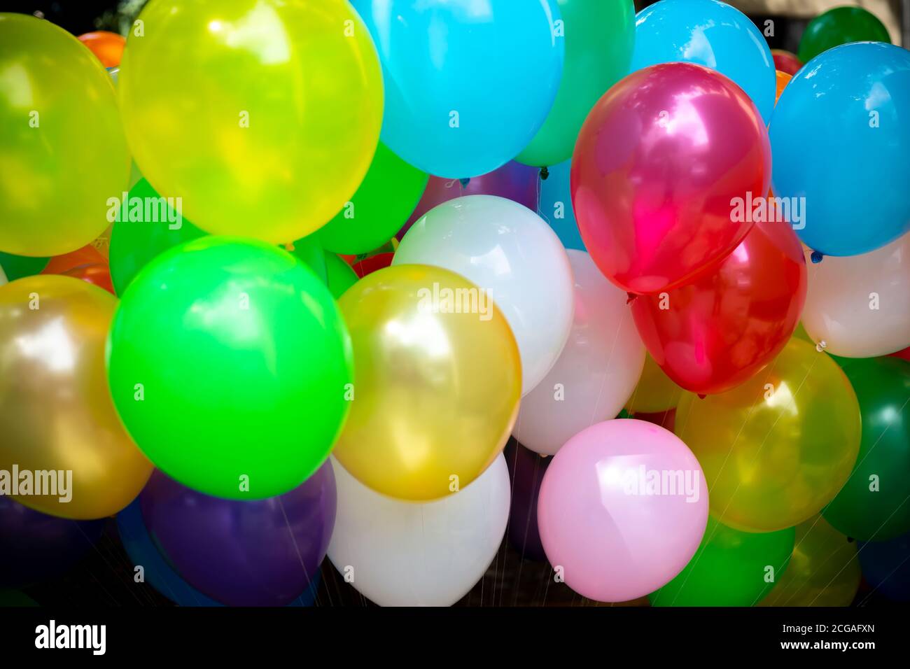 A lot of colorful balloons close-up views. Balloons of many colours ...