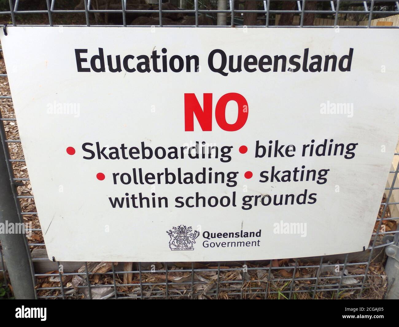 A Education Queensland safety sign on a school fence, Queensland ...