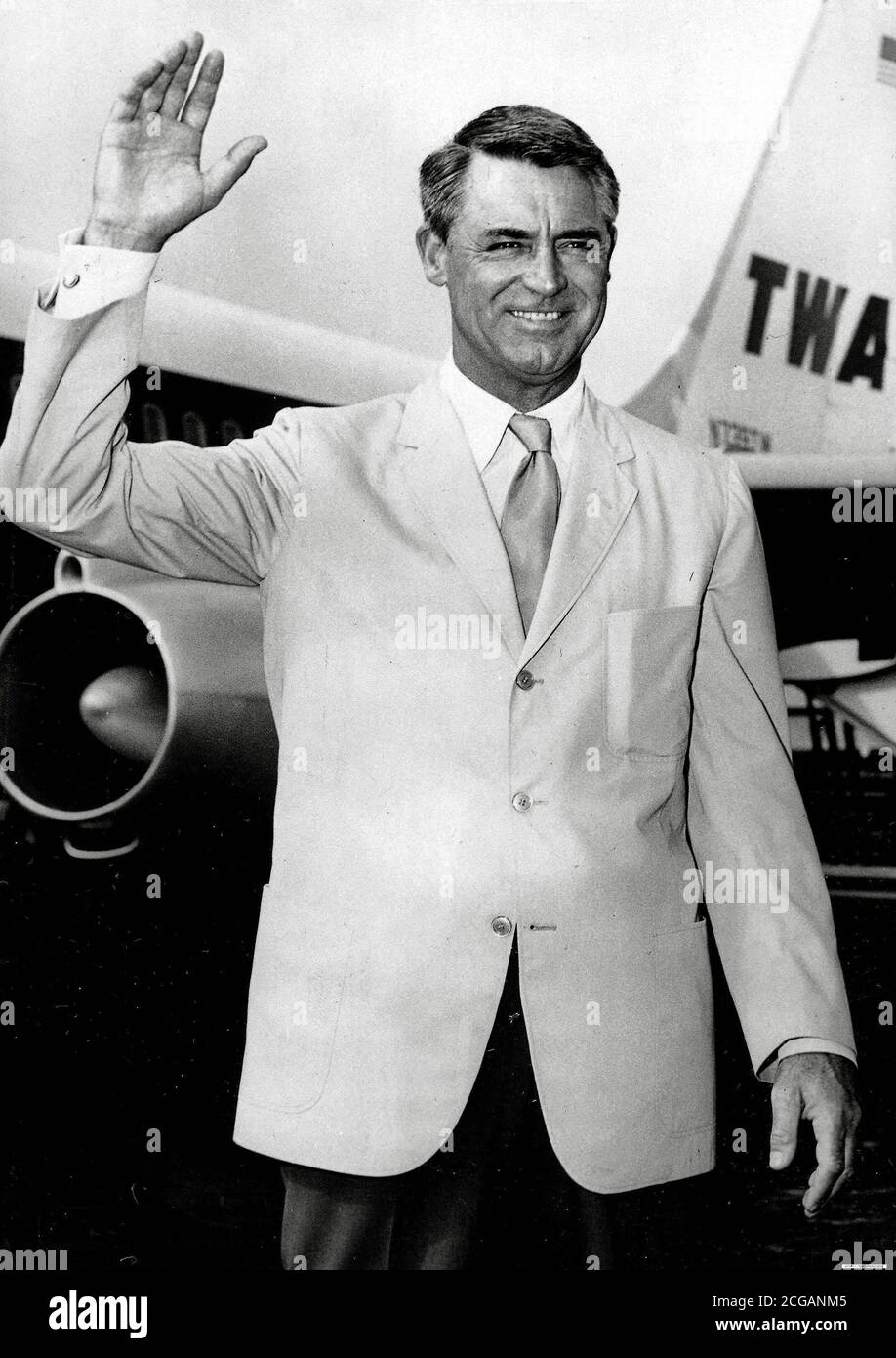 Cary Grant waving at the airport, circa 1959 / File Reference # 34000 ...