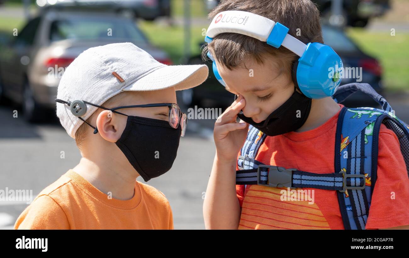 Two boys walking together school hi-res stock photography and images ...