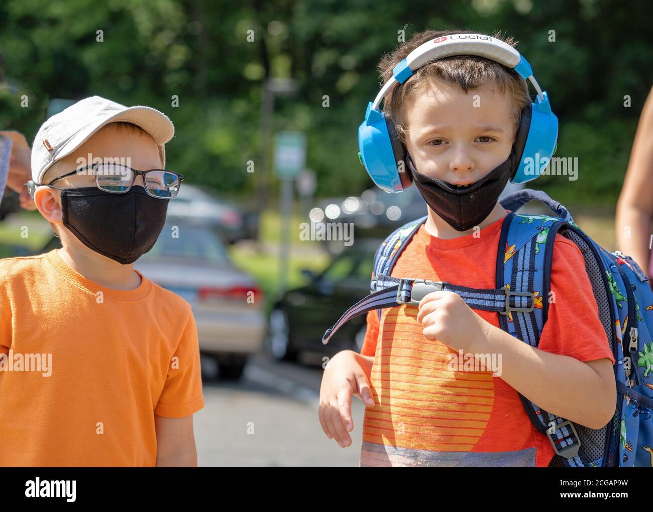 Two boys walking together school hi-res stock photography and images ...