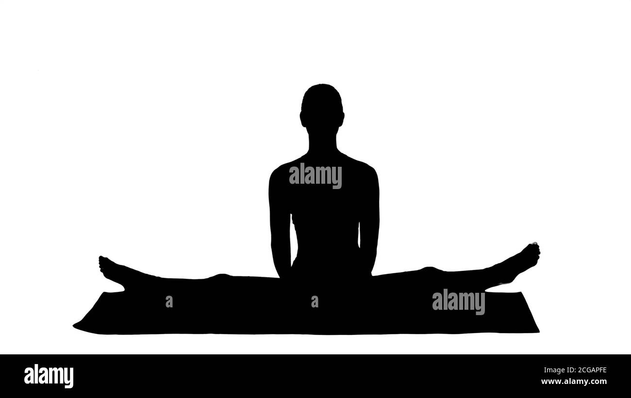 Silhouette Woman taking a Lotus pose Stock Photo - Alamy