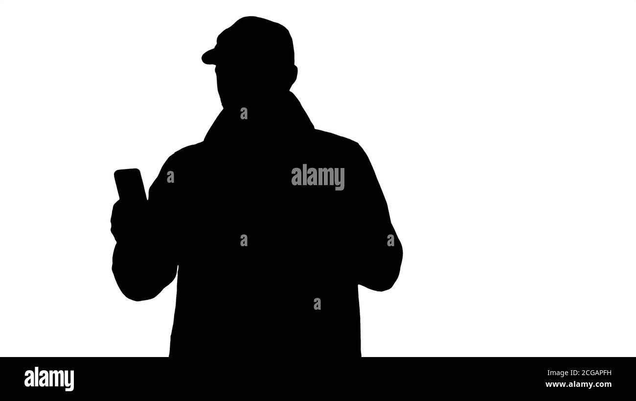 Silhouette Young man making a video call from his mobile phone while ...