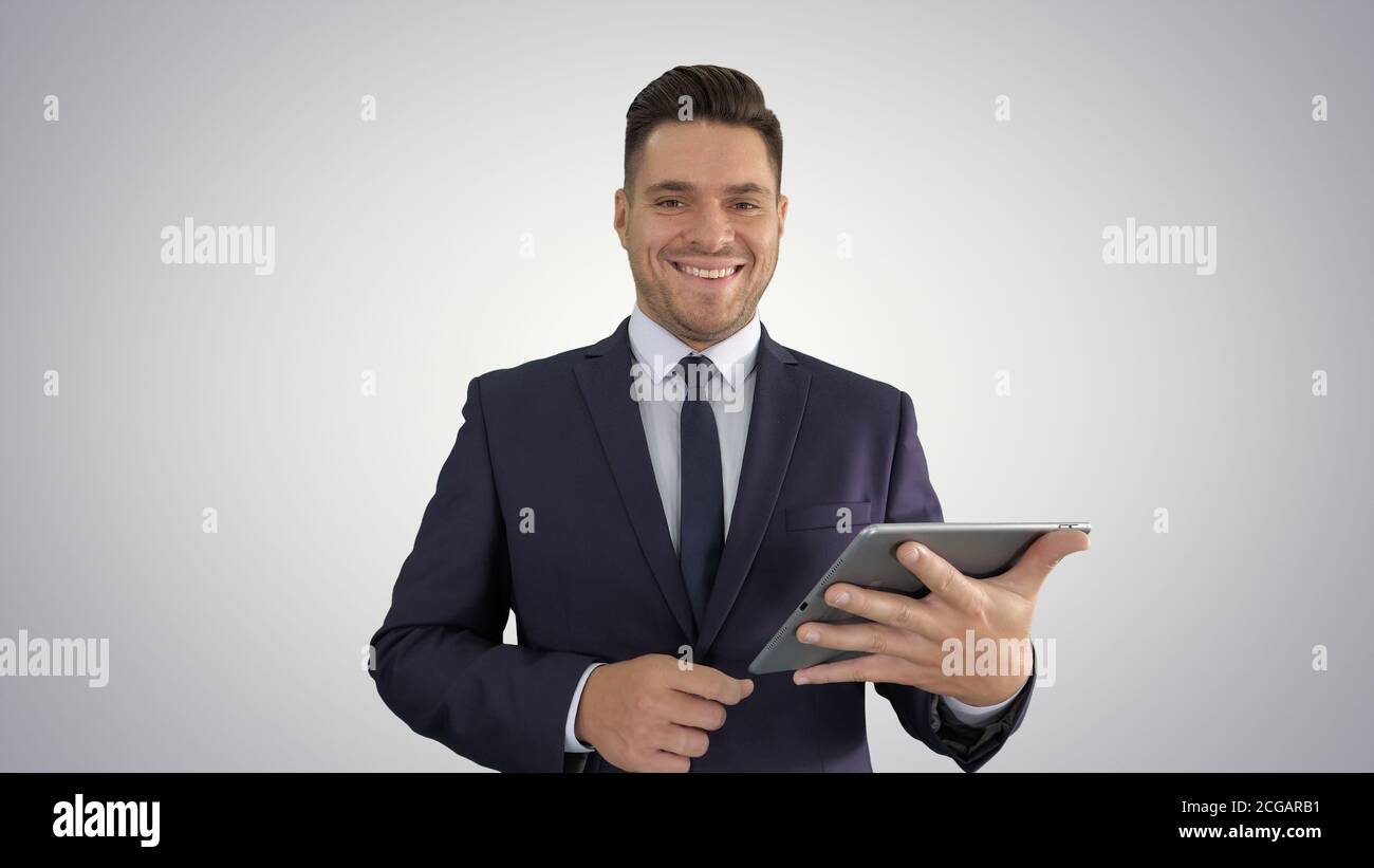 Caucasian male swiping tablet screen hi-res stock photography and ...