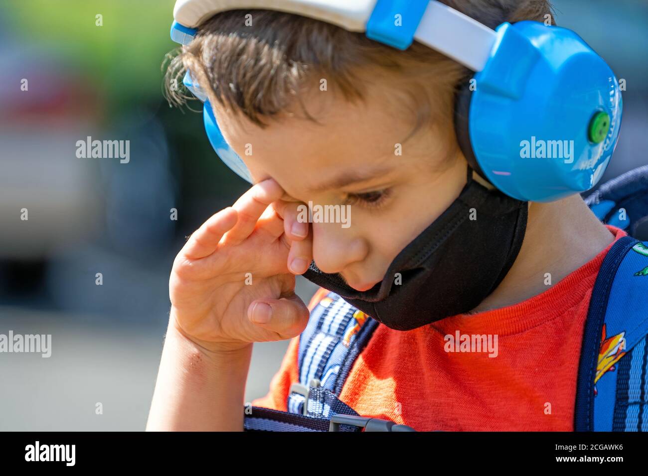 4 year old boy first day back to school wearing facial mask and ...