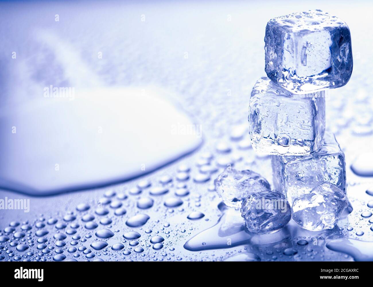 Three melting ice cubes on bright background Stock Photo - Alamy
