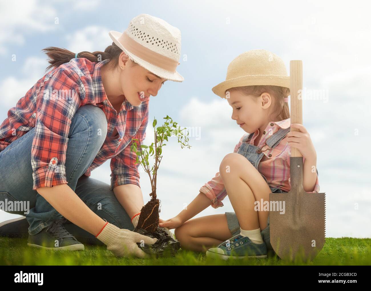 Girl planting sapling hi-res stock photography and images - Alamy
